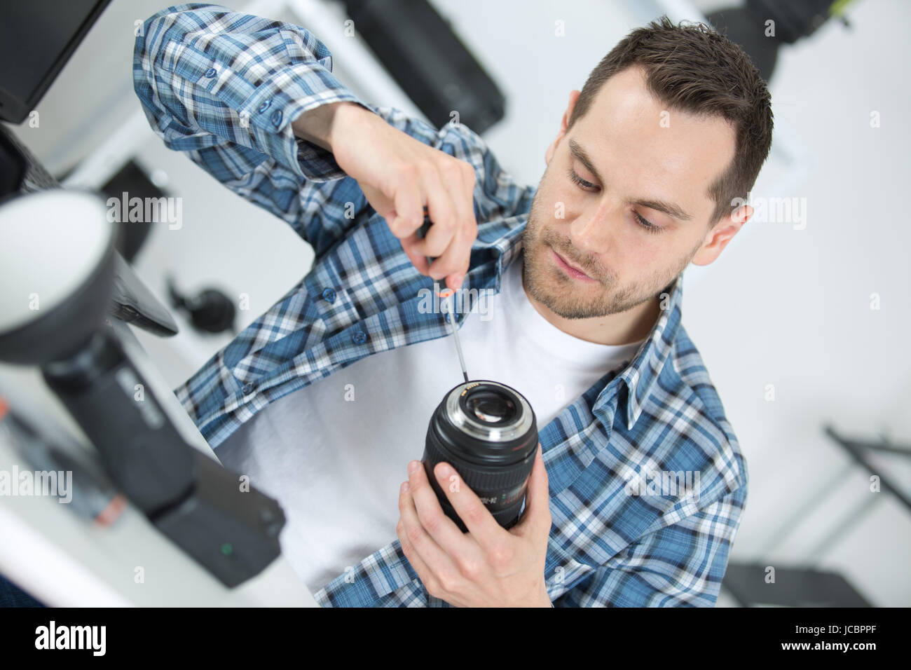 fixing the lens Stock Photo - Alamy