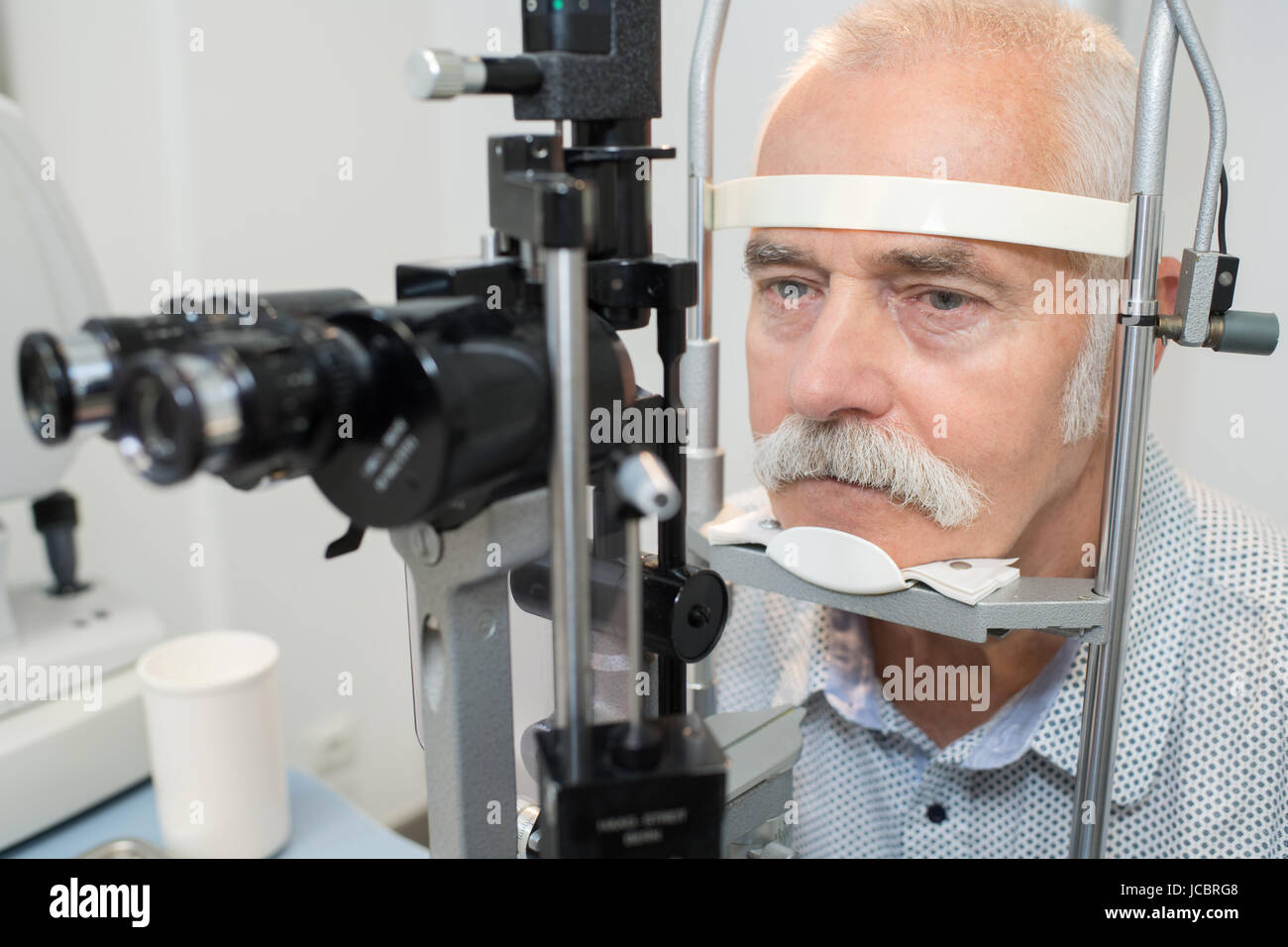 close-up of an optometrist checking senior male patient vision Stock ...