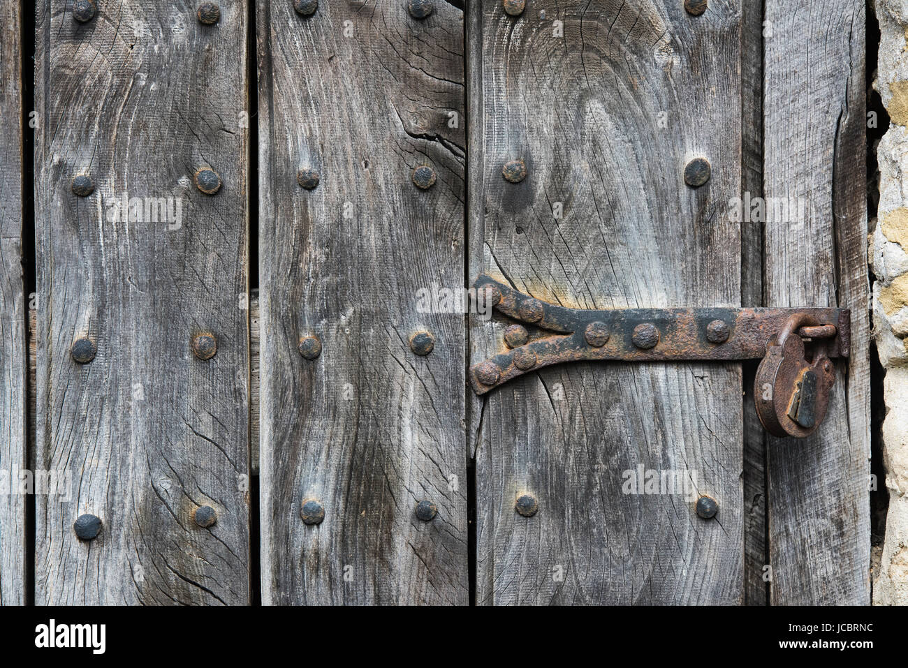 Detail of The door to the former village lock-up with the Swinford ...