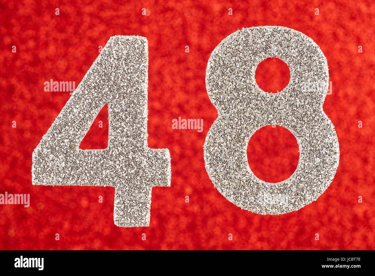 Number forty-eight silver color over a red background. Anniversary ...