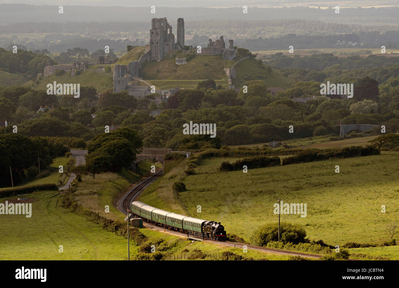 Steam train with a backdrop of Corfe Castle on the Swanage Railway in ...