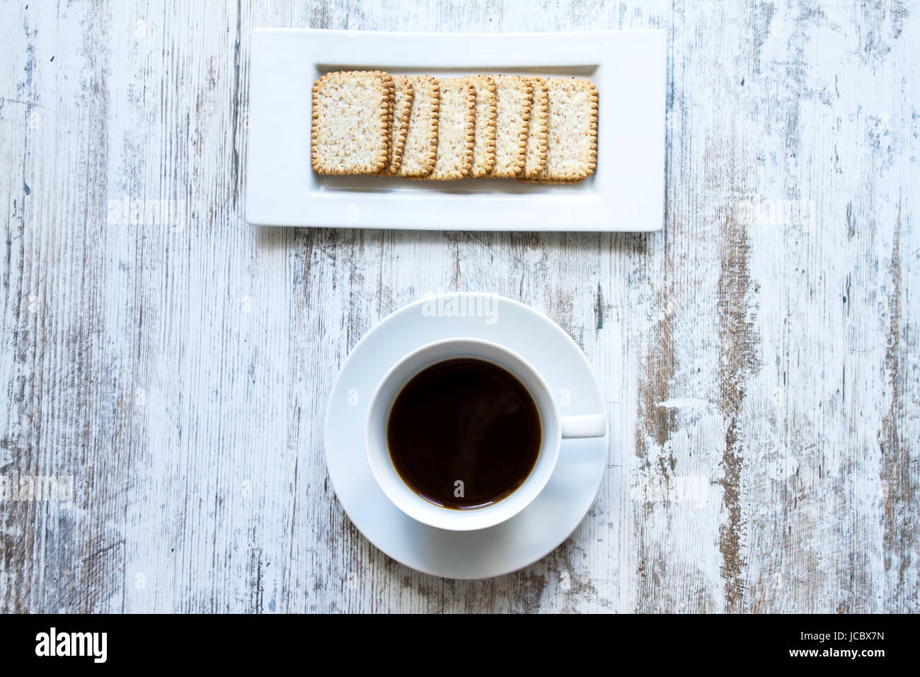Coffee with crackers on a wooden table Stock Photo - Alamy