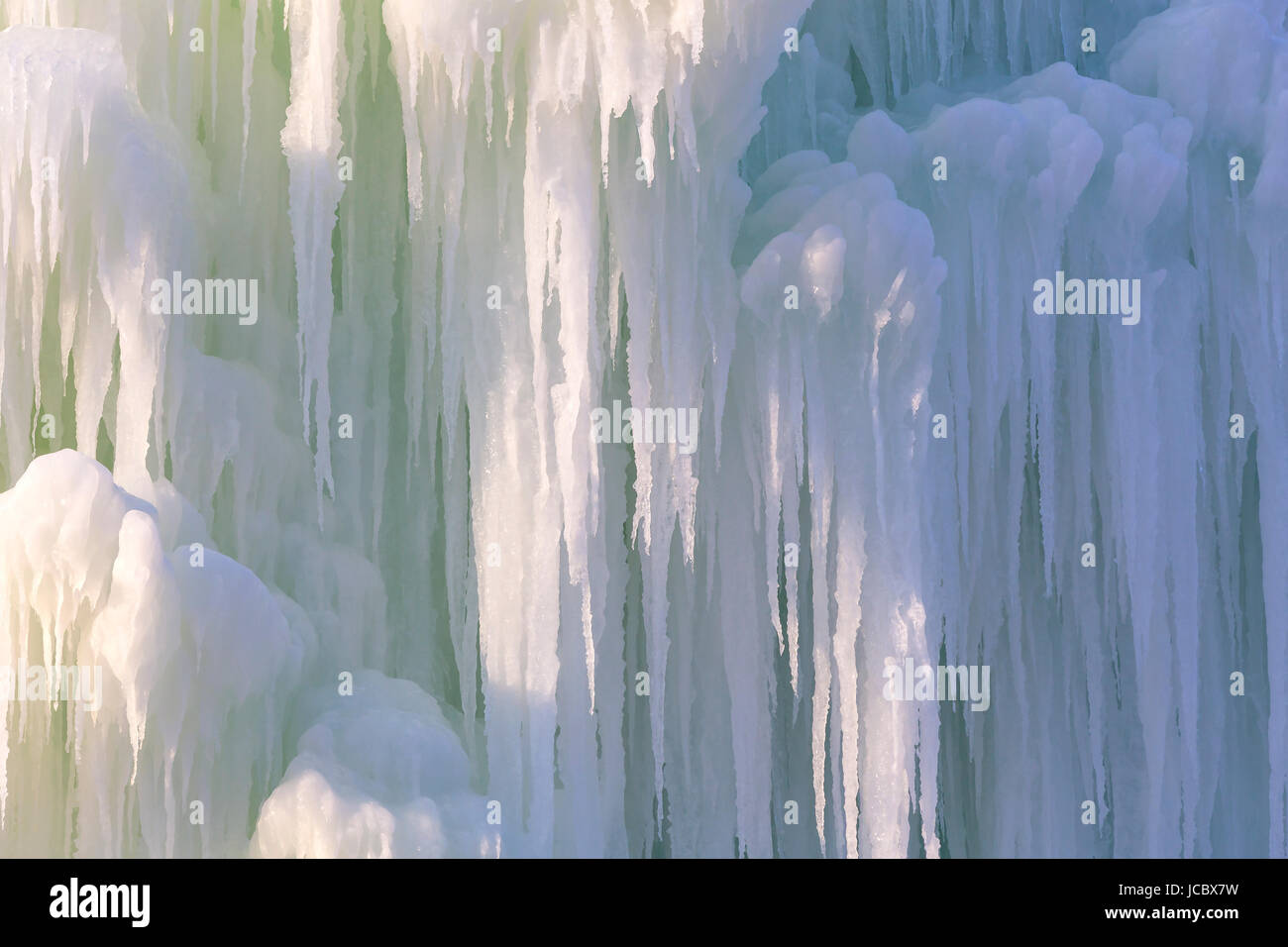Icicles of ice in the winter of a frozen waterfall Stock Photo - Alamy