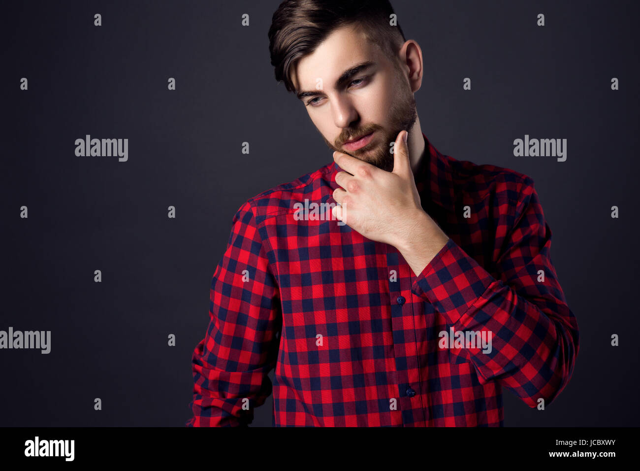 Side view portrait of thinking stylish young man looking away Stock ...