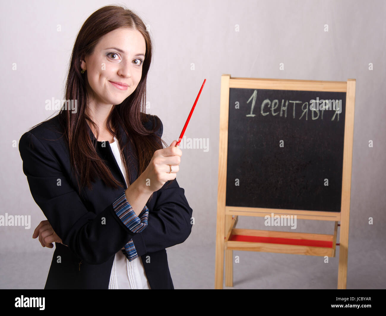 Portrait of the teacher. In the hands of the teacher's pointer. The ...