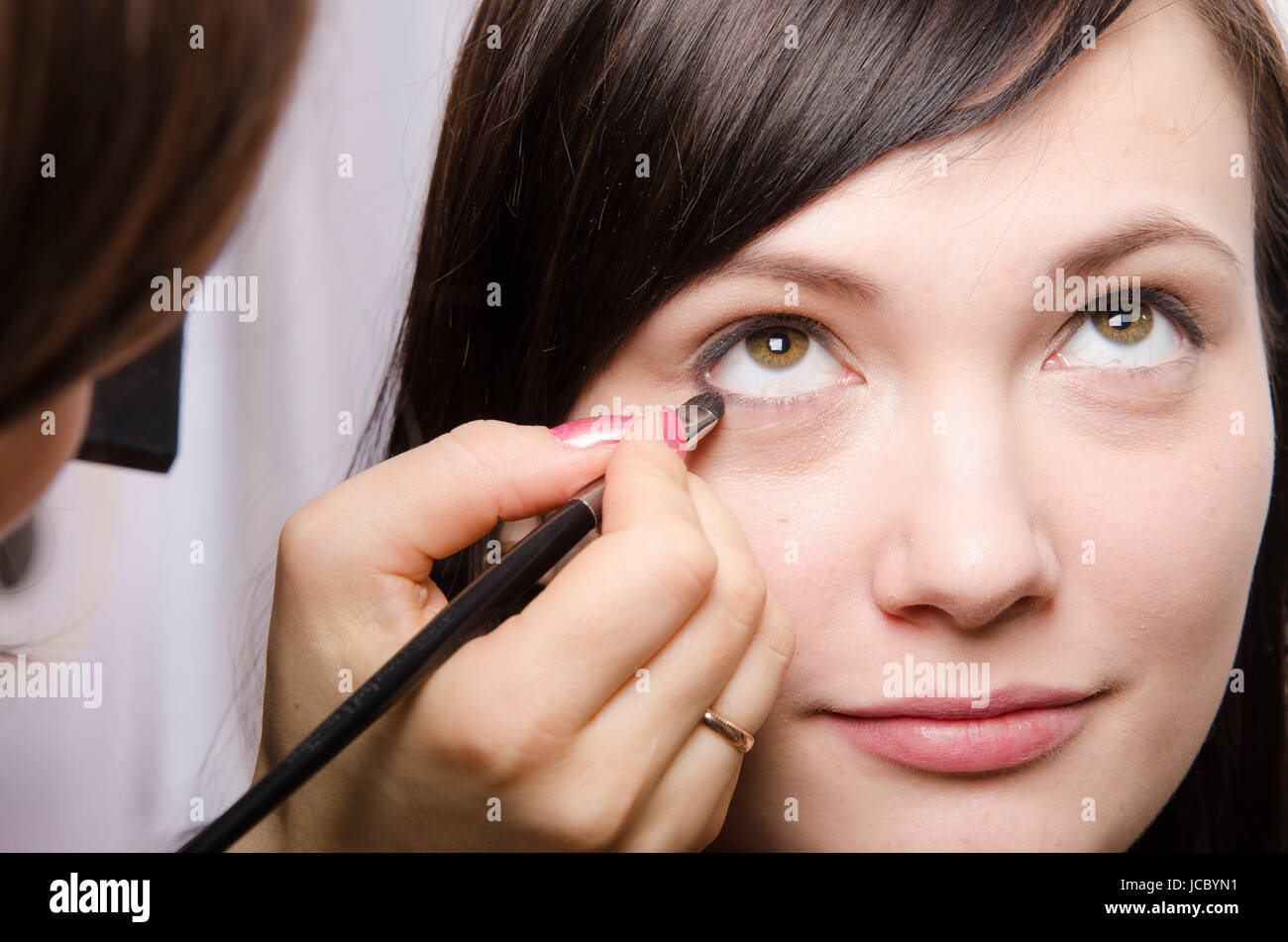 Woman paints her eyelashes hi-res stock photography and images - Alamy