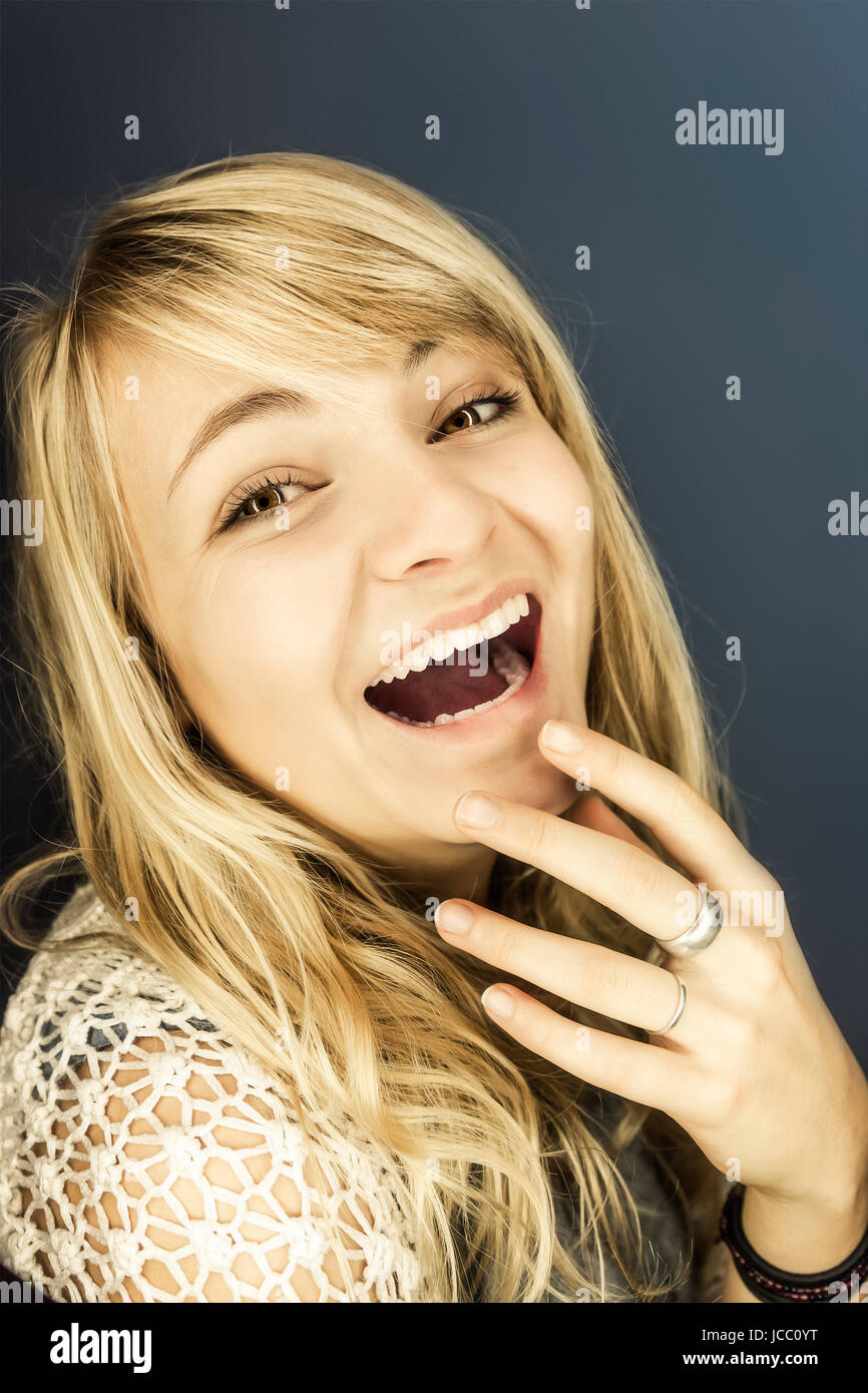 An image of a beautiful smiling blond girl Stock Photo - Alamy