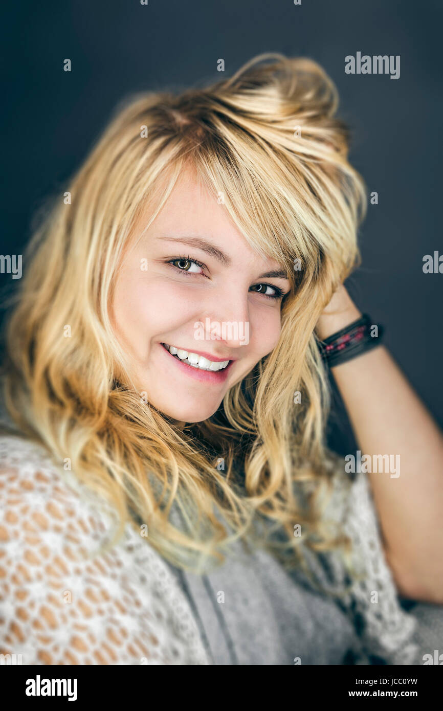 An image of a beautiful smiling blond girl Stock Photo - Alamy