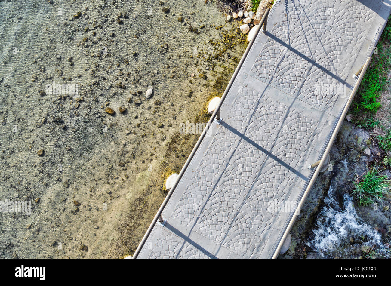 Aerial view of bridge over Mijares river. Swimming area of thermal ...