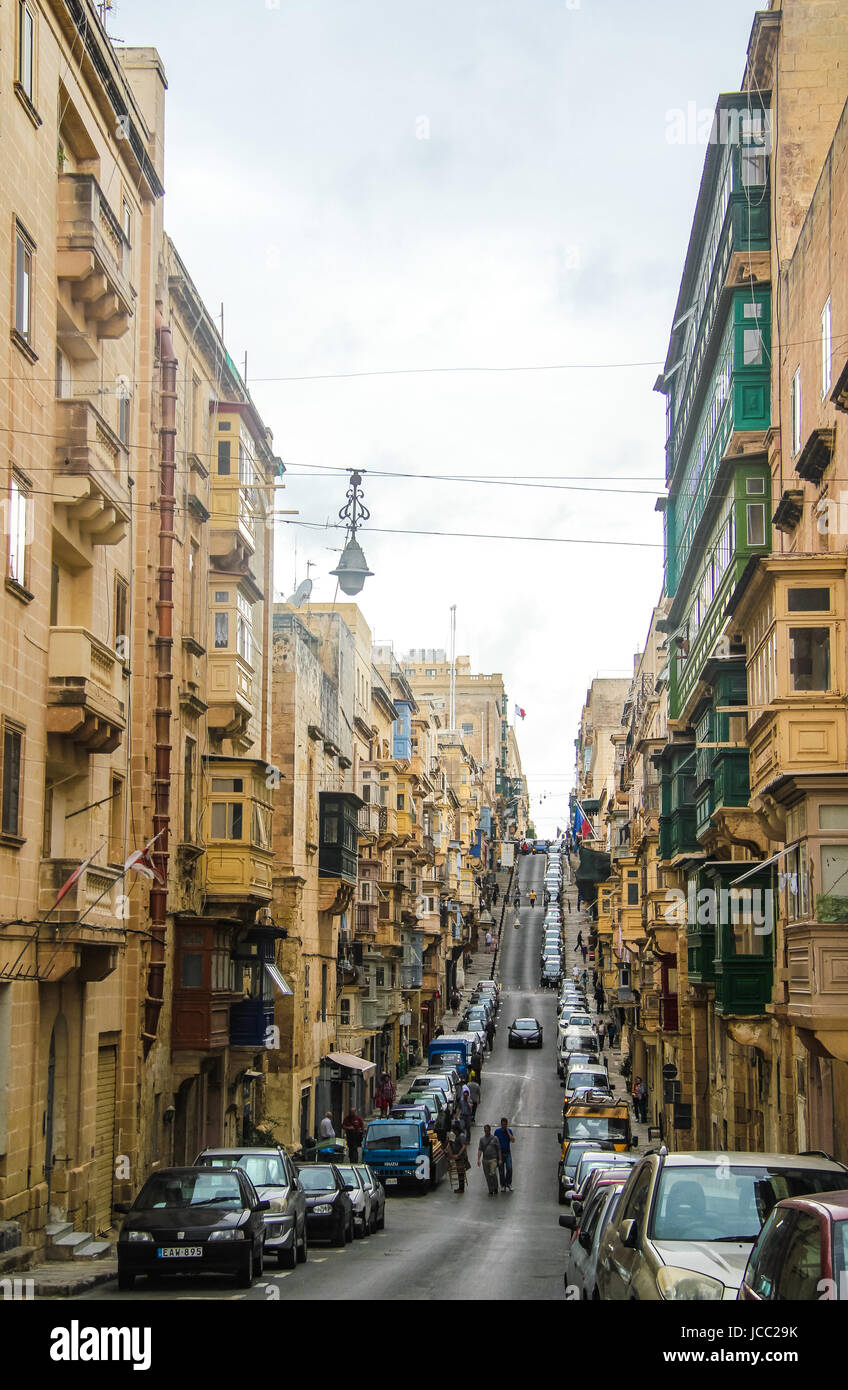 Typical narrow streets with colorful balconies in Valletta , Malta ...