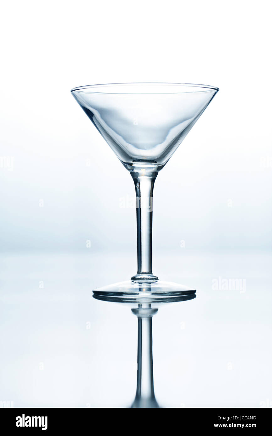 Empty cocktail glass on blue and white gradient background Stock Photo ...