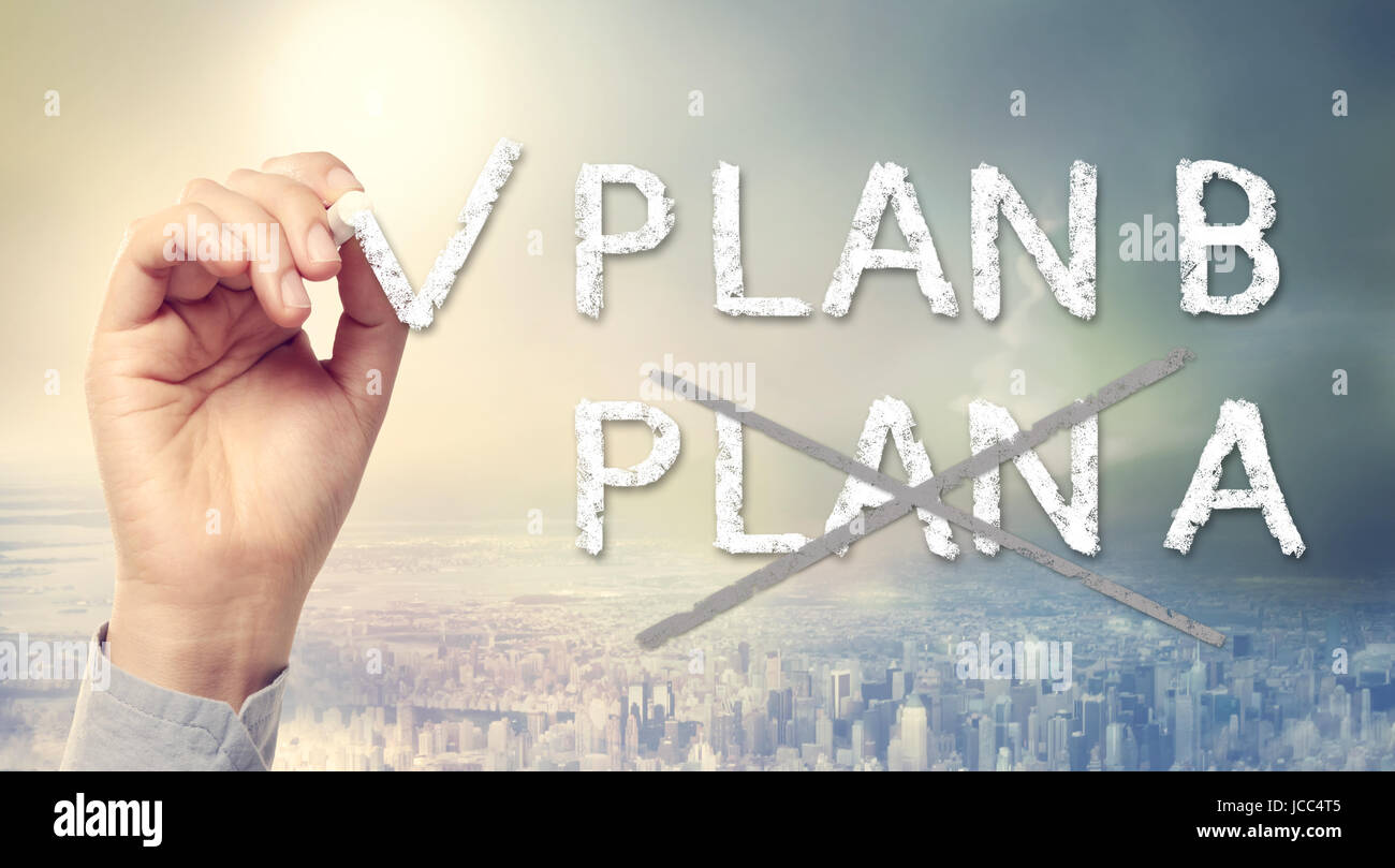 Hand checking PLAN B over the city skyline background Stock Photo - Alamy