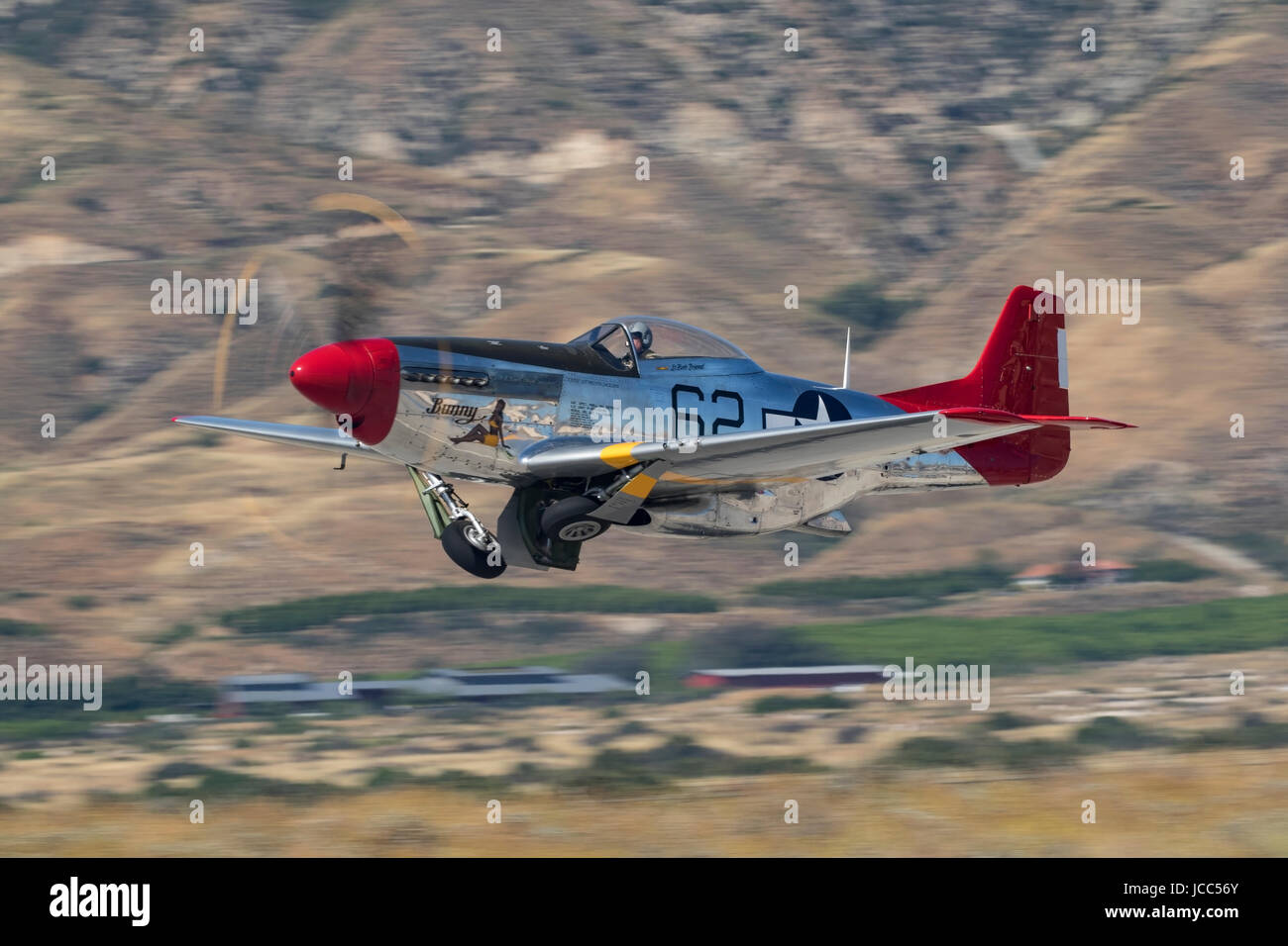 Airplane WWII vintage Red Tail P-51 Mustang fighter flying at ...