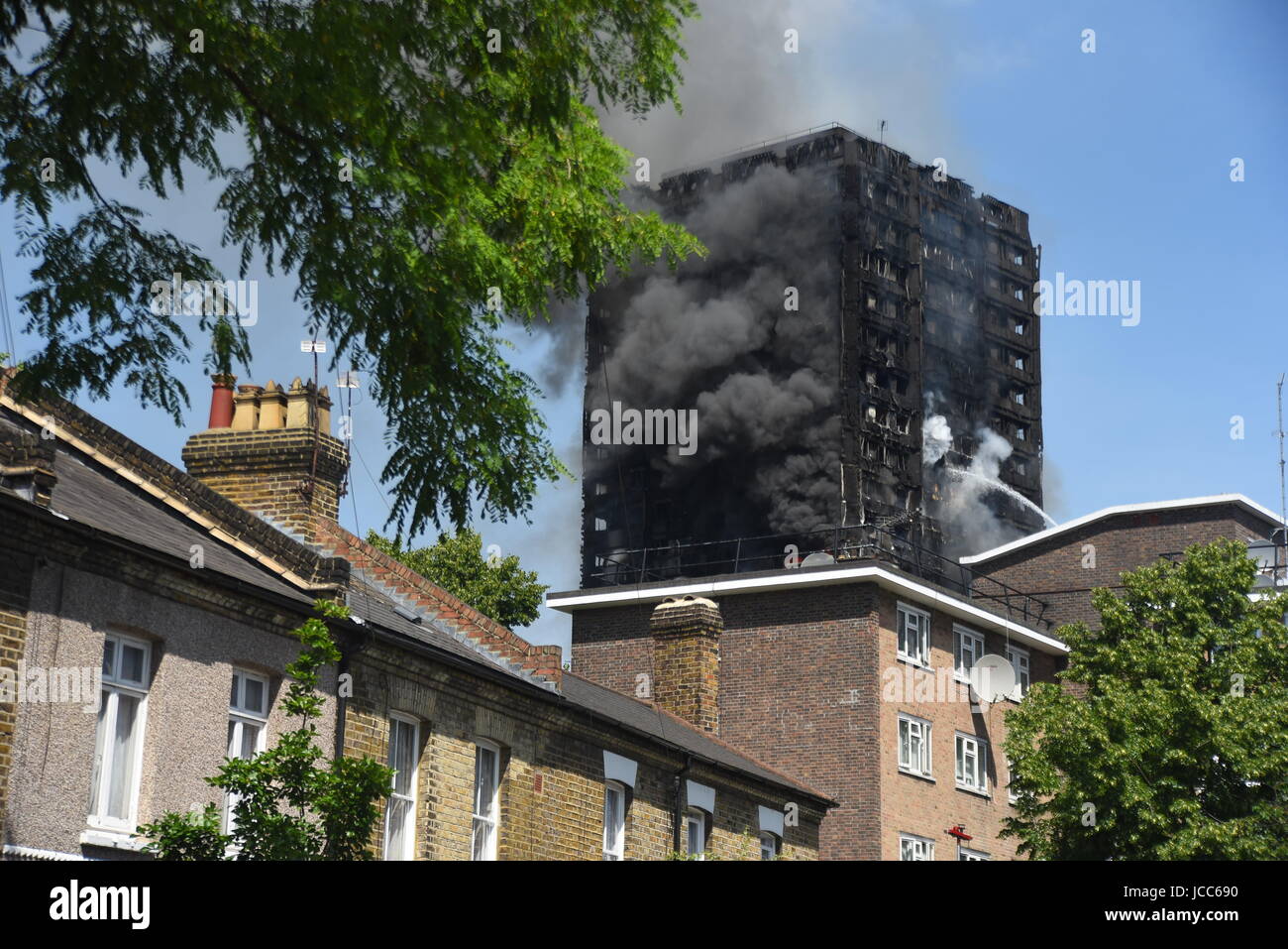 Smoke billows from residential hi-res stock photography and images - Alamy