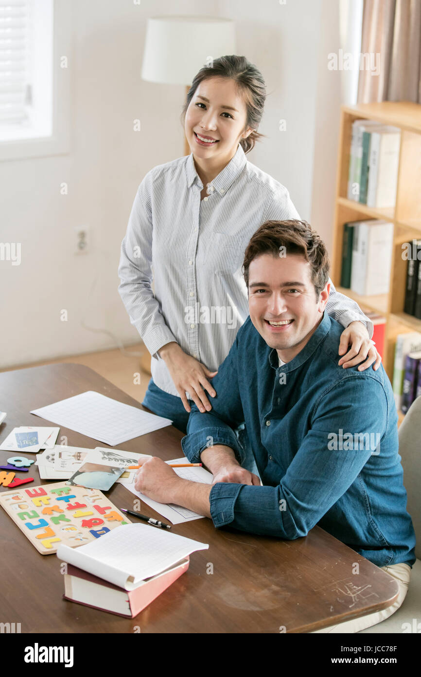 Multicultural people sitting around table hi-res stock photography and ...