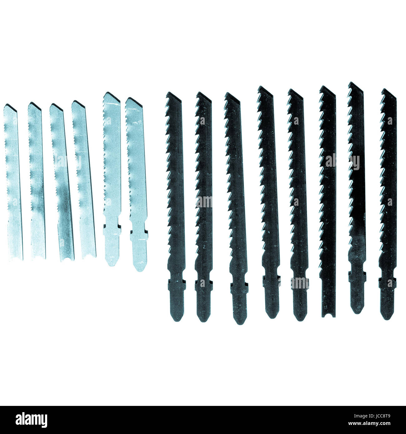 Metal and wood jigsaw blades isolated over white - cool cyanotype Stock ...