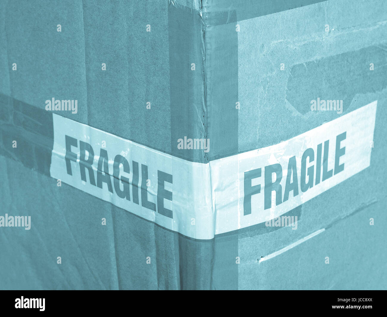 Detail of a fragile corrugated cardboard packet - cool cyanotype Stock Photo - Alamy