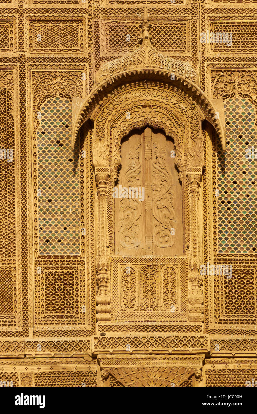 Delicate carved stone walls and window surrounds of a wealthy merchants ...