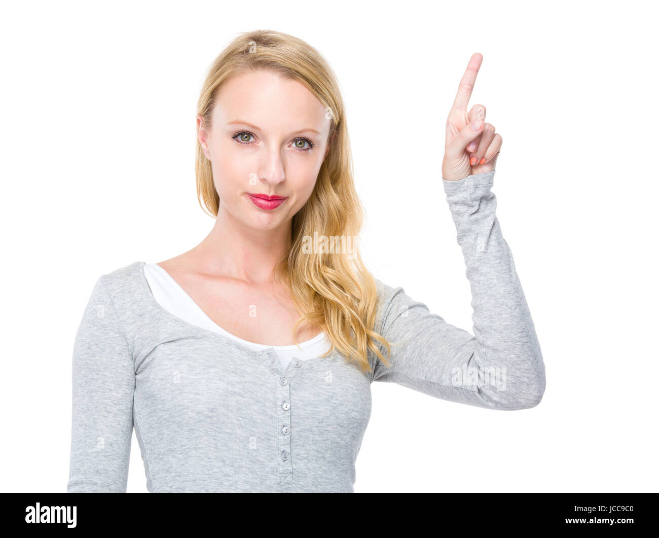 Woman with finger point up Stock Photo - Alamy