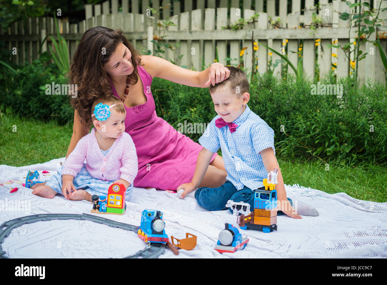 Happy mother and two children Stock Photo - Alamy