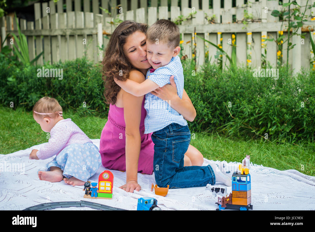 Happy mother and two children Stock Photo - Alamy