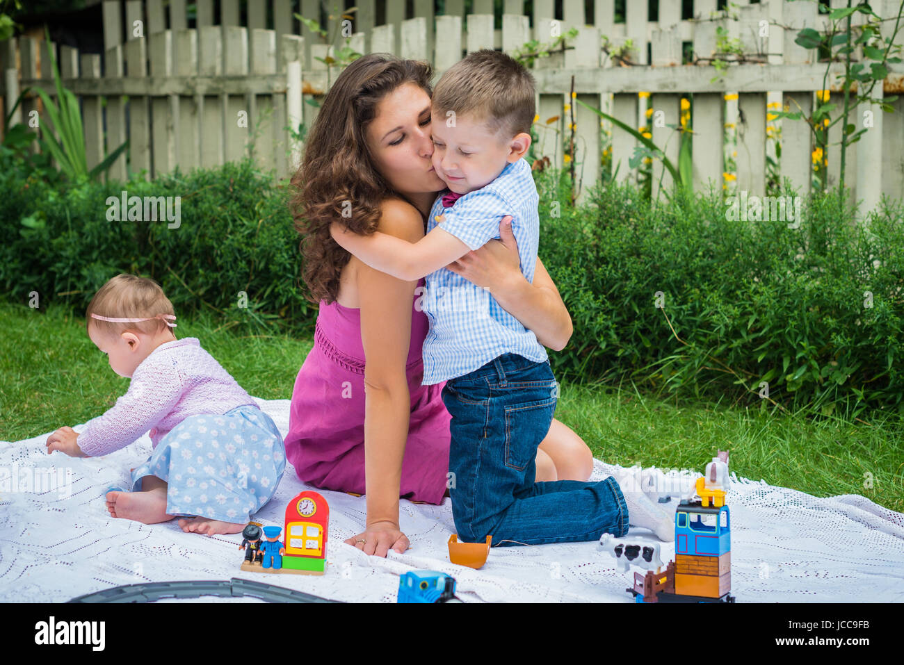 Happy mother and two children Stock Photo - Alamy
