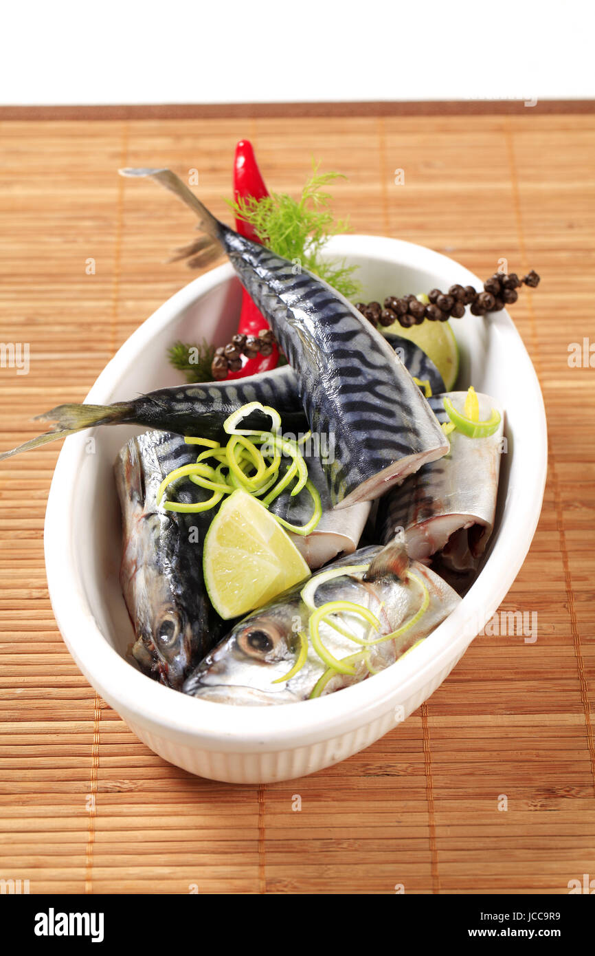 Pieces of raw mackerel in a casserole dish Stock Photo - Alamy