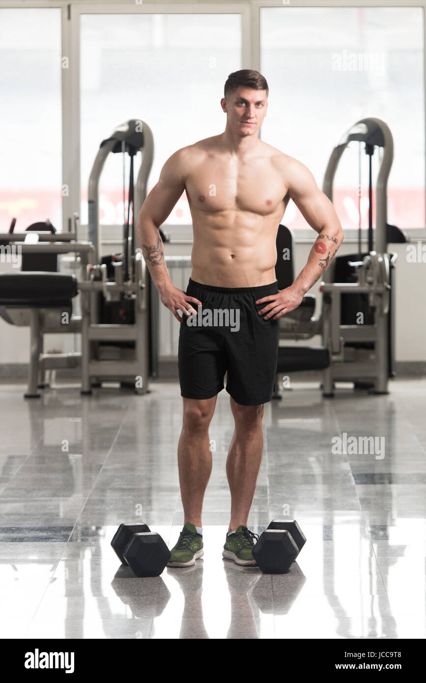 Good Looking And Attractive Young Man With Muscular Body Standing In ...