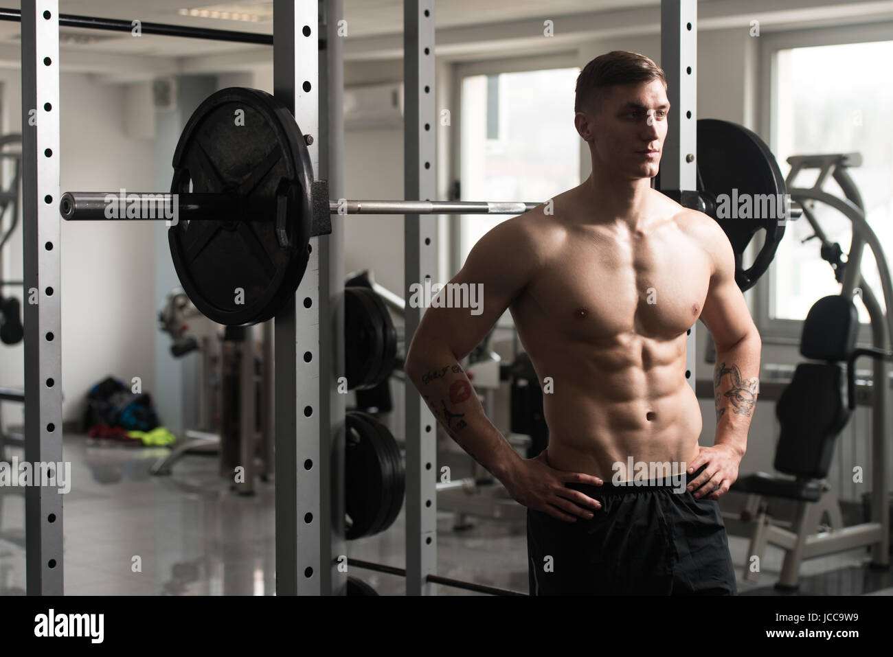Good Looking And Attractive Young Man With Muscular Body Standing In ...
