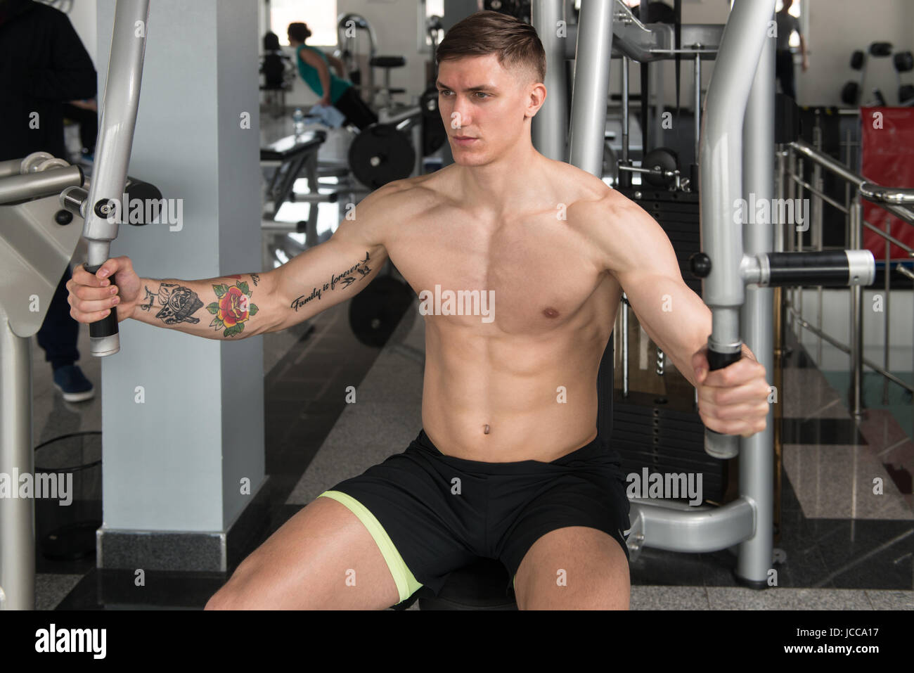Handsome Muscular Fitness Bodybuilder Doing Heavy Weight Exercise For ...