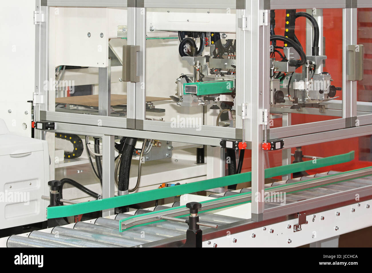 Lidding machine for packing boxes Stock Photo - Alamy