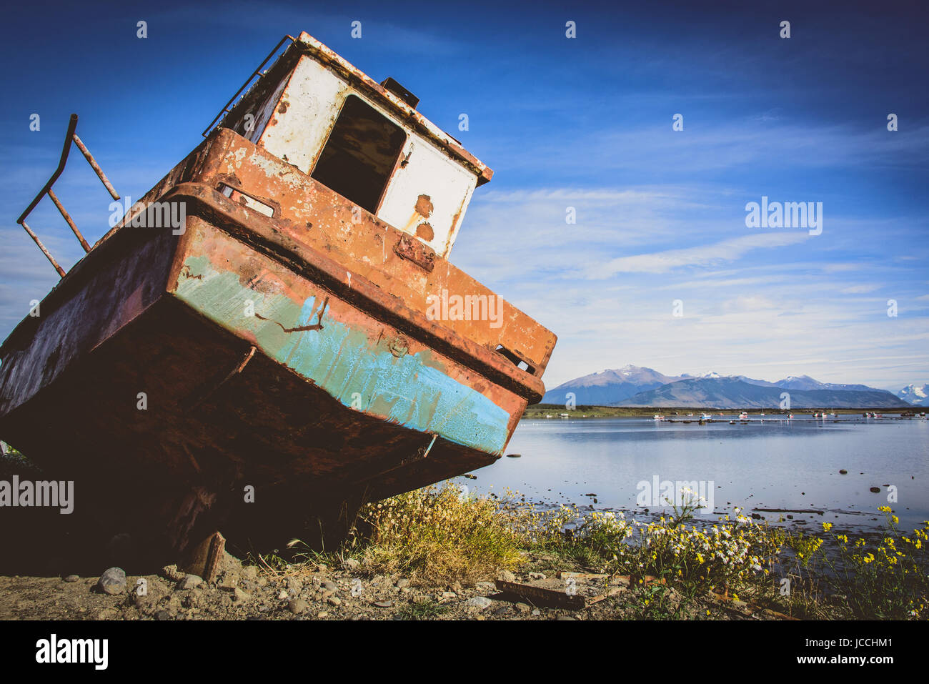 Rusty ship wreck in Puerto Natales Stock Photo - Alamy