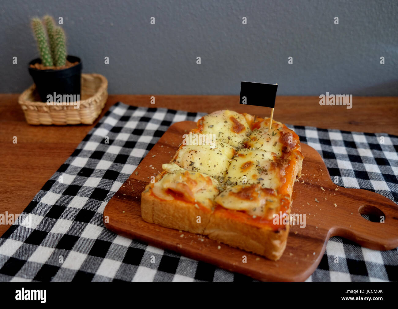 Pizza toasted bread with tomato sauce and ham cheese selective focus ...