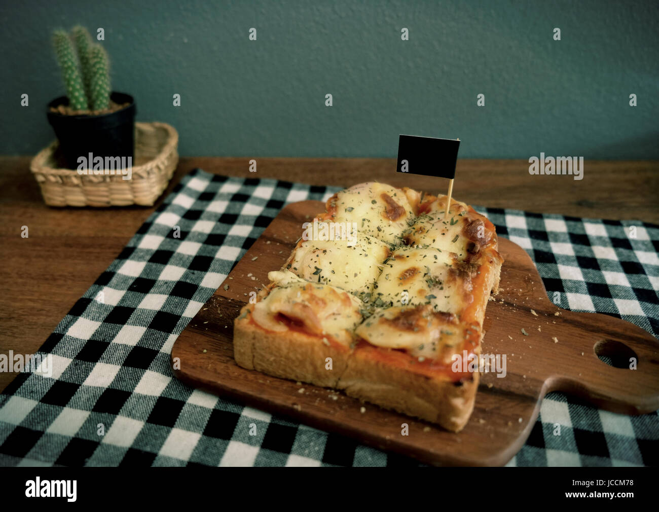 Pizza toasted bread with tomato sauce and ham cheese selective focus ...