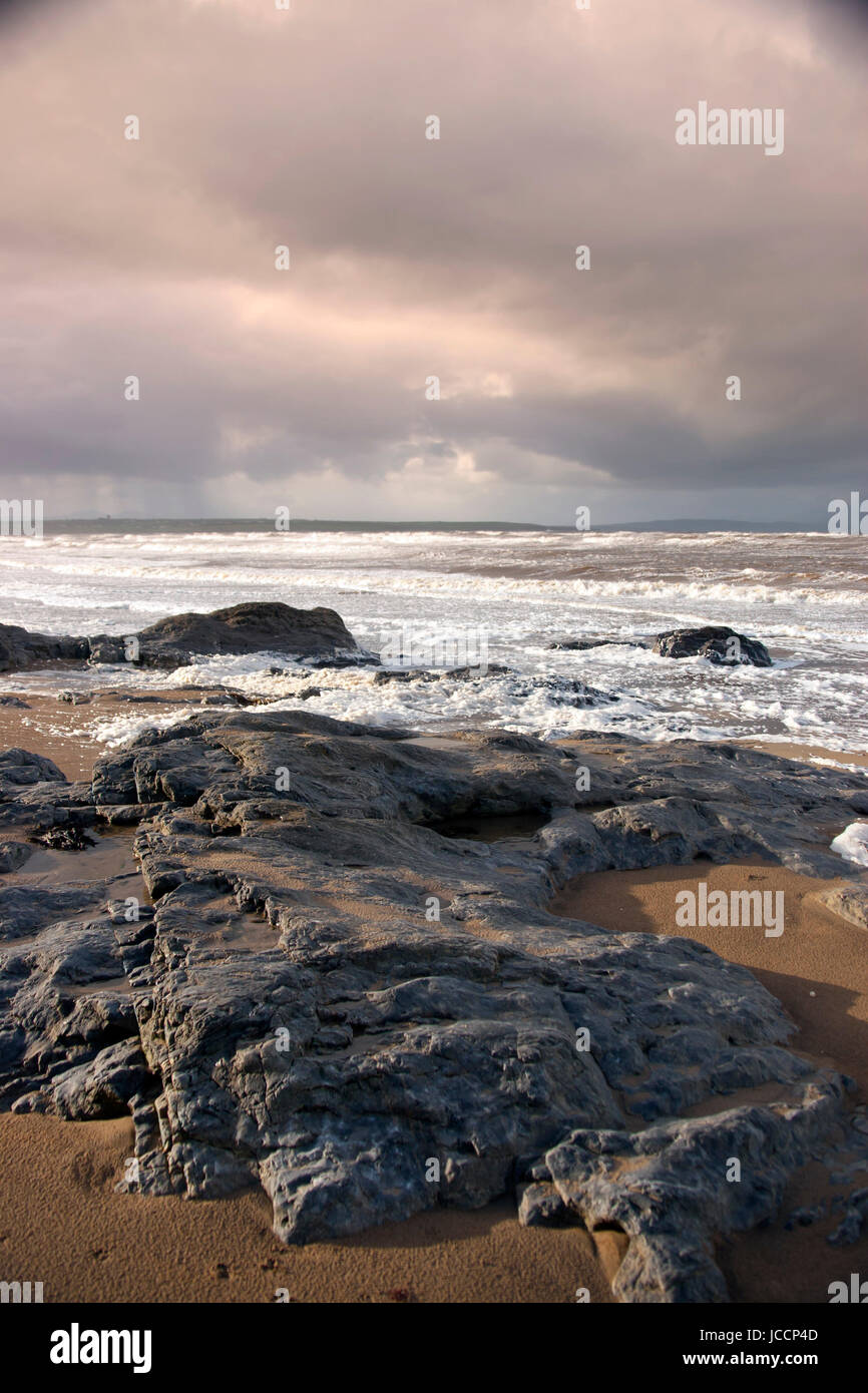 the black rocks on Ballybunion beach in county Kerry Ireland after a ...