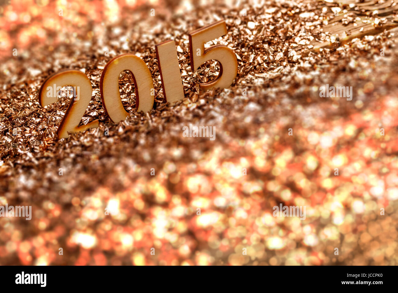 2015 wooden number on golden glittering background Stock Photo - Alamy