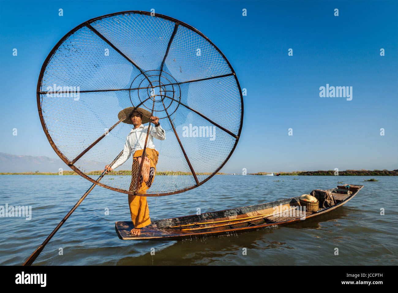 Myanmar travel attraction landmark - Traditional Burmese fisherman with ...