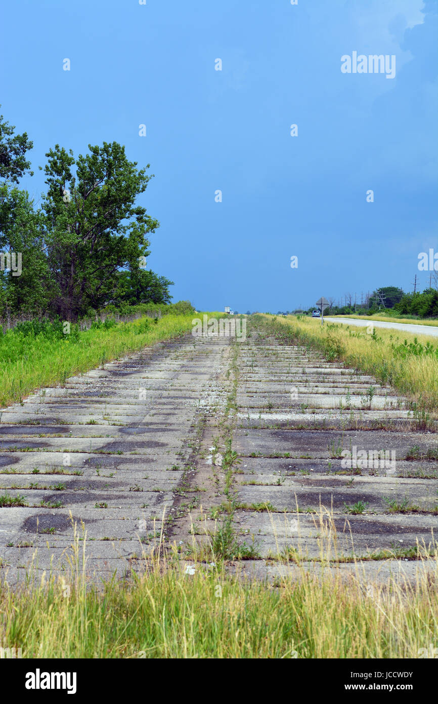 A section of the original Rte 66 roadway is overgrown and abandoned ...