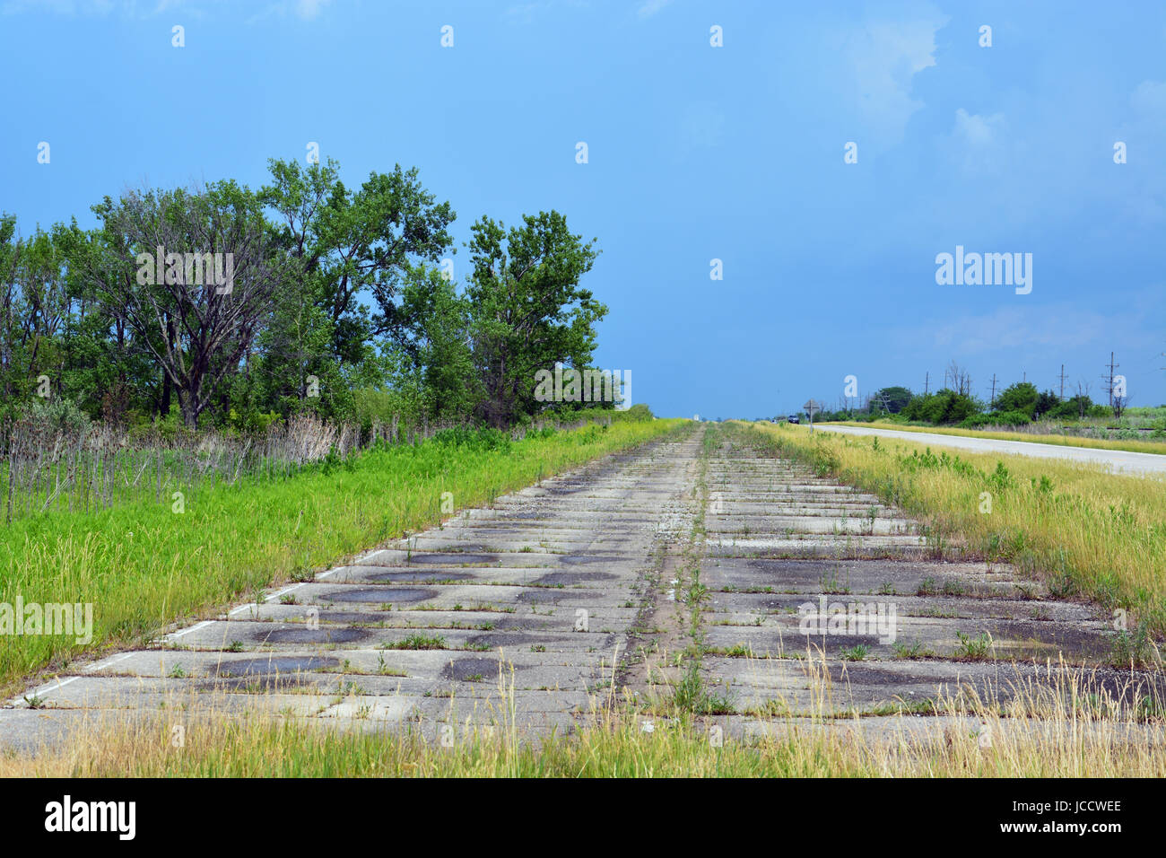 A section of the original Rte 66 roadway is overgrown and abandoned ...