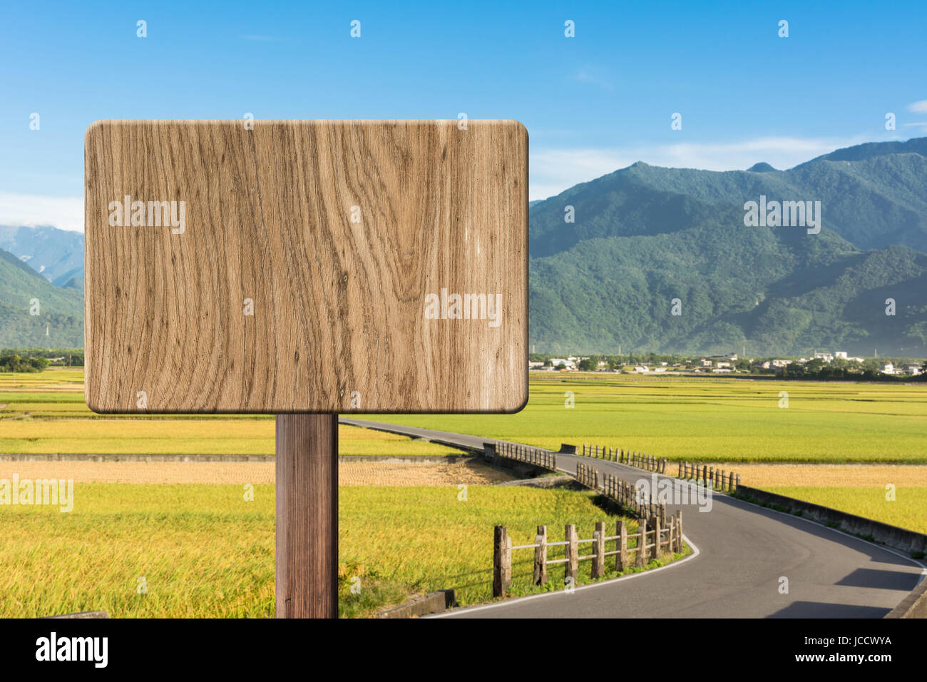 Blank wooden sign on field of farm. Concept of rural, idyllic ...