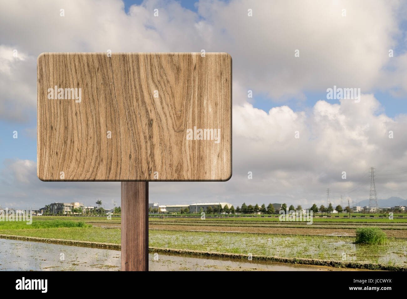 Blank wooden sign on field of farm. Concept of rural, idyllic ...