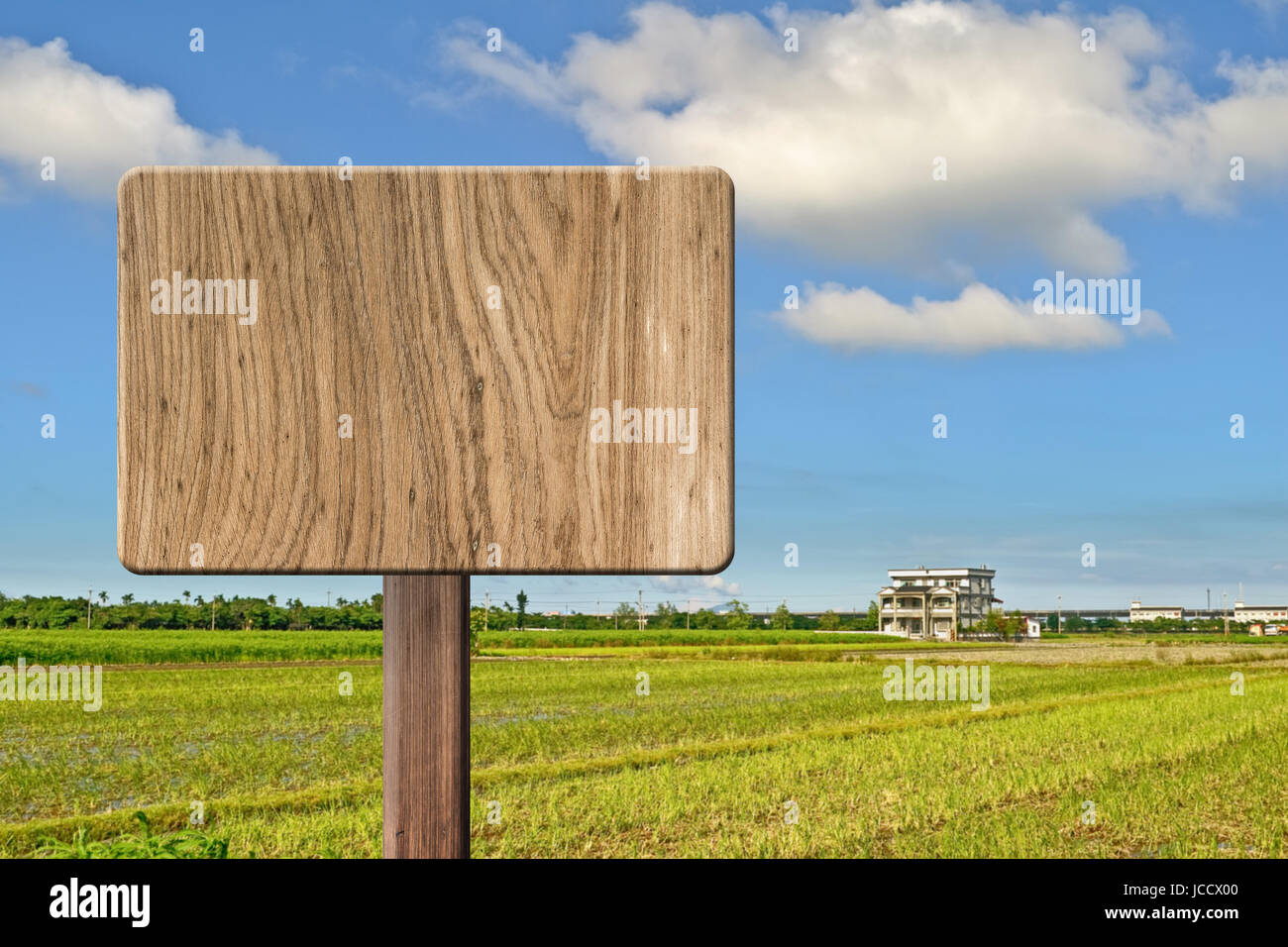 Blank wooden sign on field of farm. Concept of rural, idyllic ...