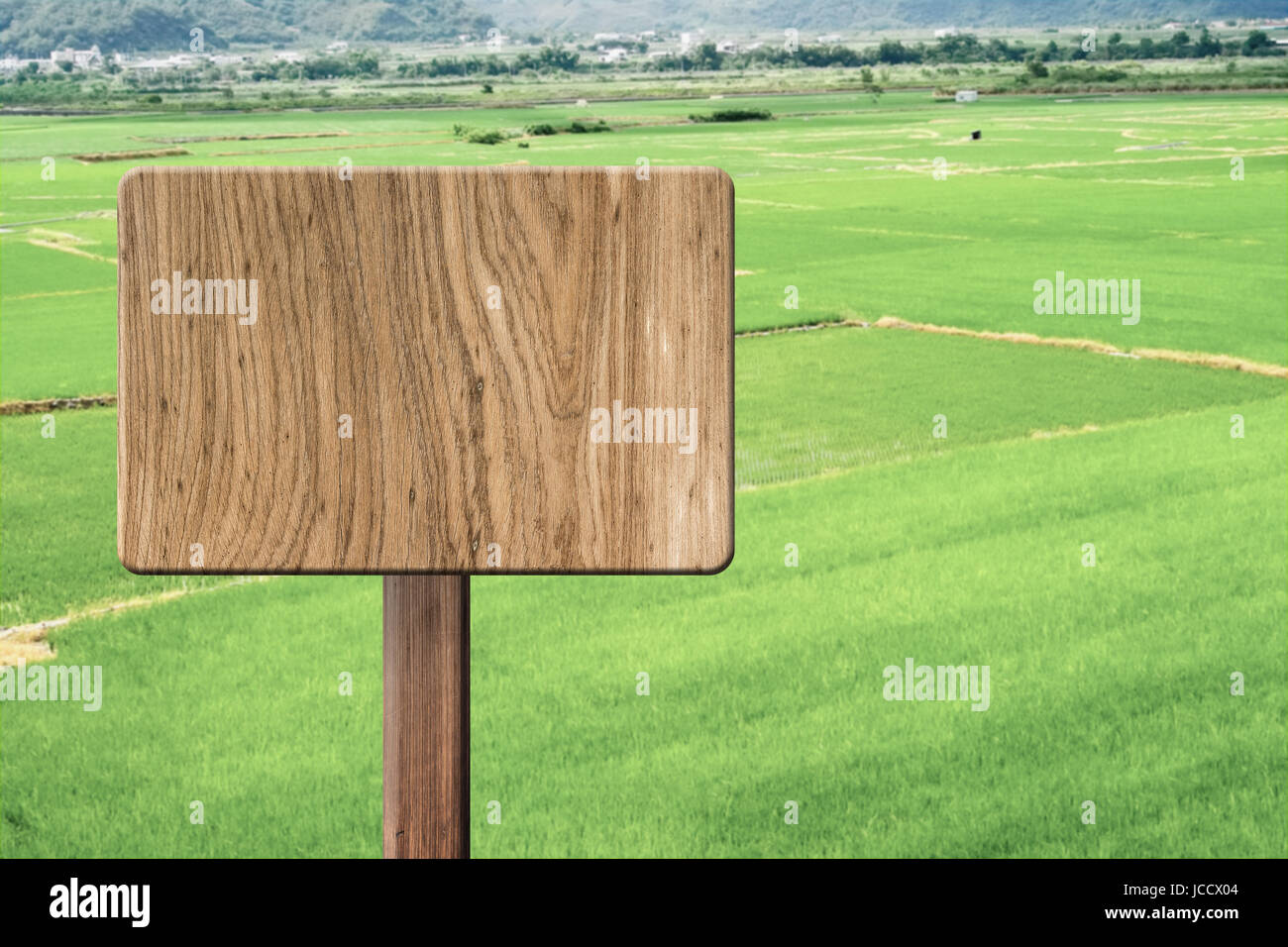 Blank wooden sign on field of farm. Concept of rural, idyllic ...