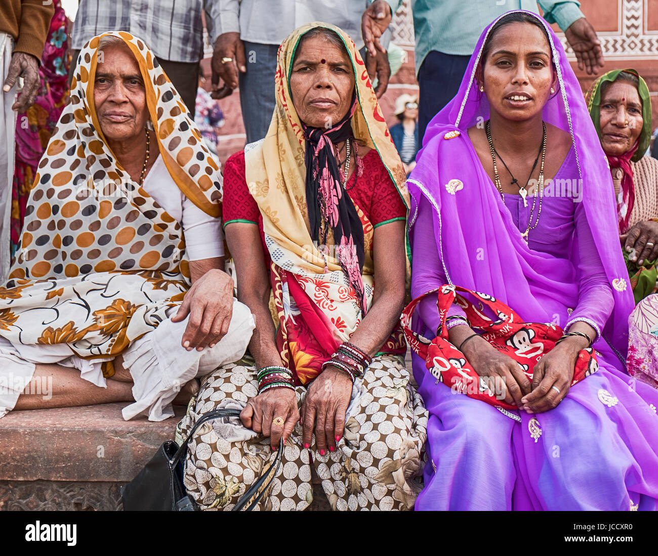 AGRA, INDIA - NOVEMBER 19, 2016: Three women in colorful saris and ...