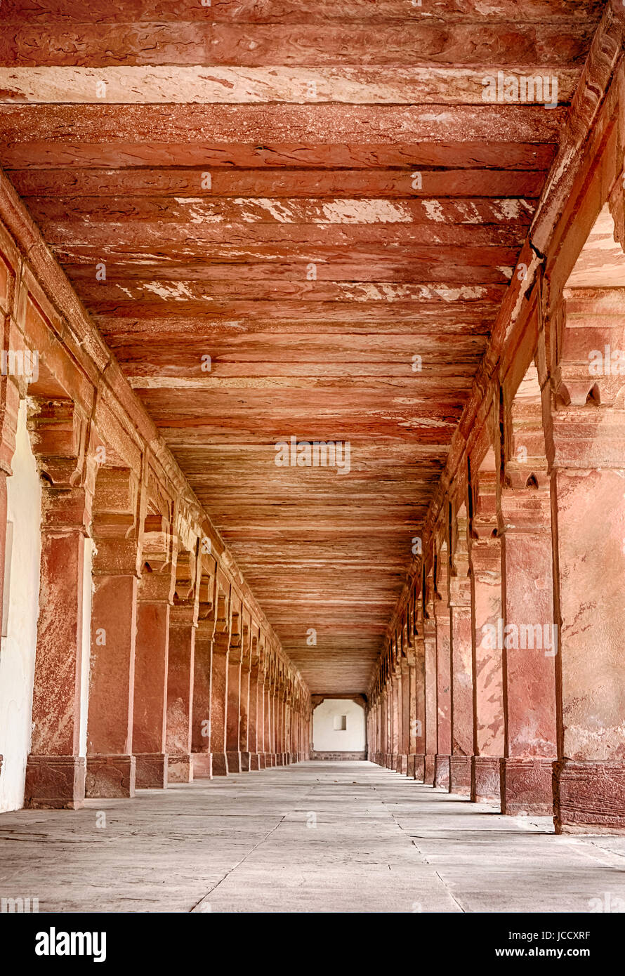 A long colonnade of red sandstone pillers is located at the ancient ...