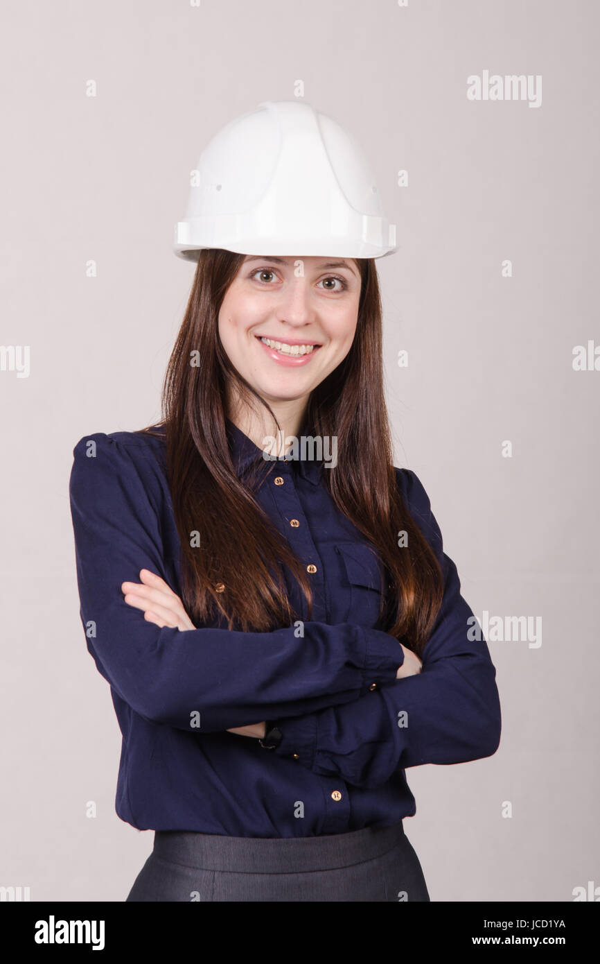 Portrait of a young beautiful girl engineer, architect in helmet Stock ...