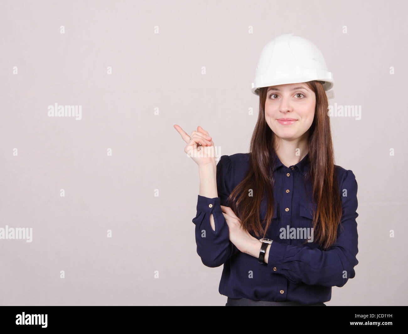 Portrait of a young beautiful girl engineer, architect in helmet Stock ...