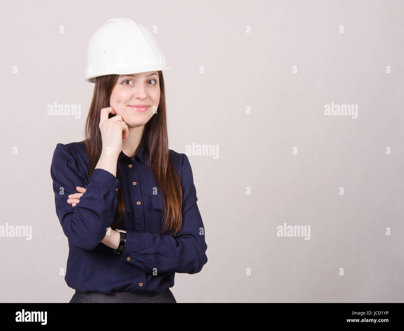 Portrait of a young beautiful girl engineer, architect in helmet Stock ...