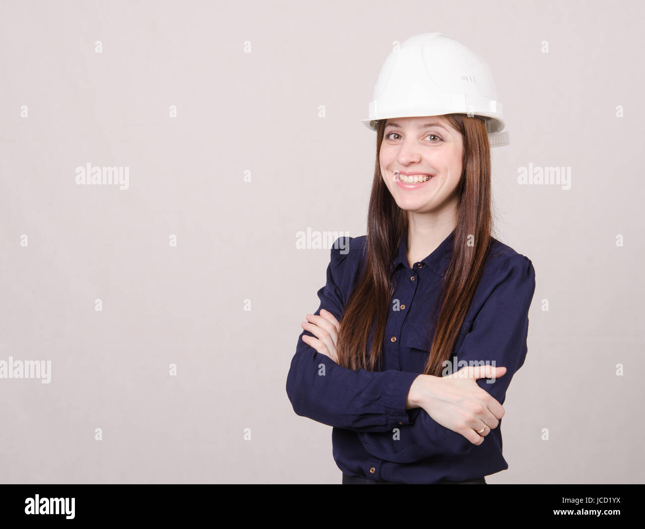 Portrait of a young beautiful girl engineer, architect in helmet Stock ...