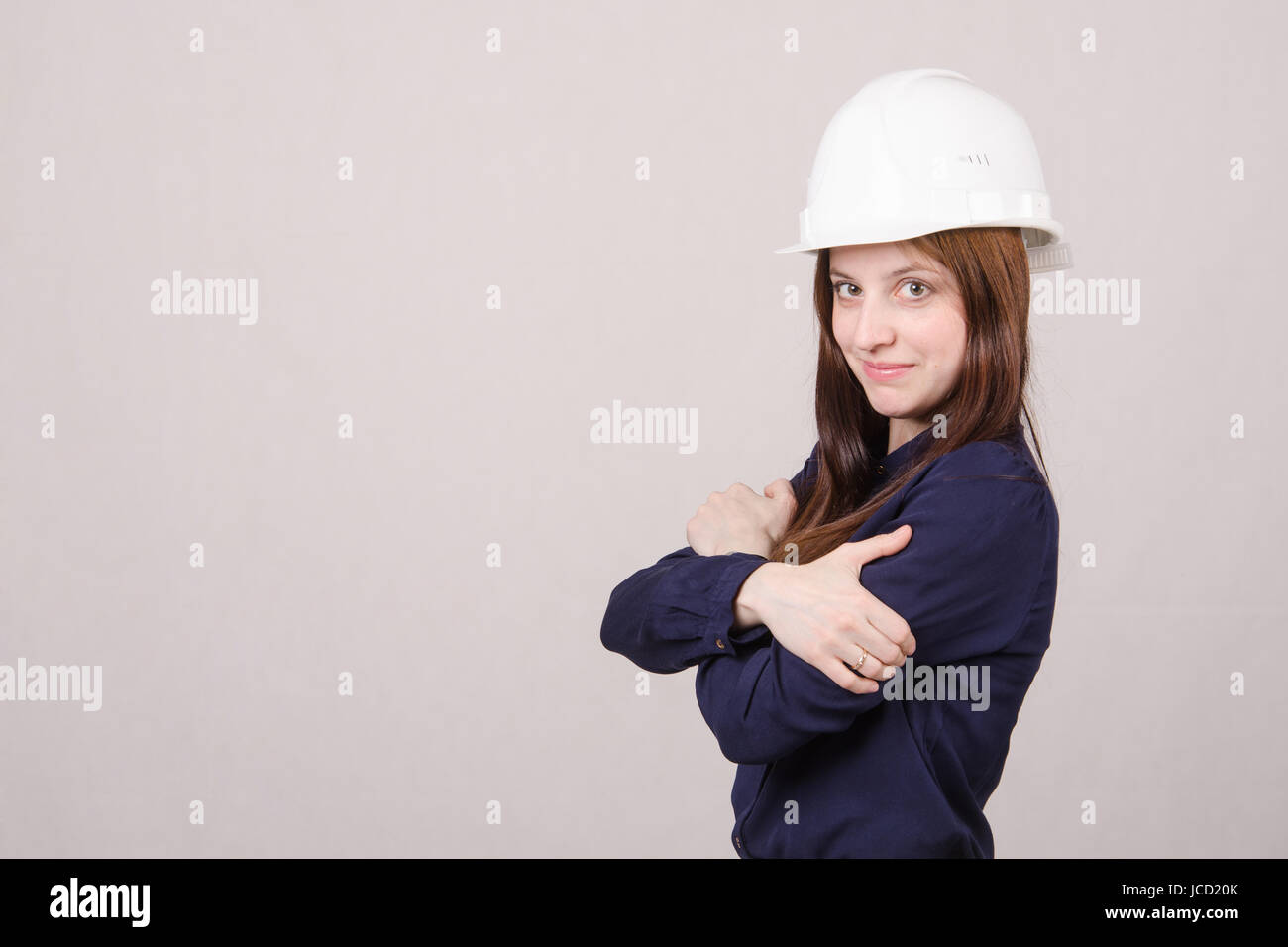 Portrait of a young beautiful girl engineer, architect in helmet Stock ...
